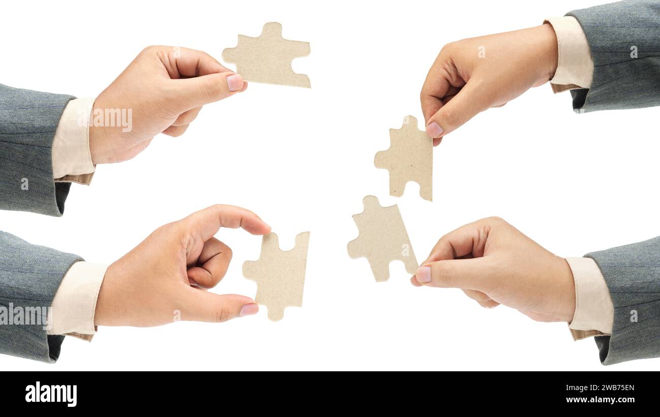 Collection of business hand holding a single piece of puzzle isolated ...