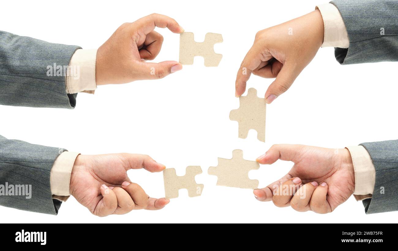 Collection of business hand holding a single piece of puzzle isolated ...