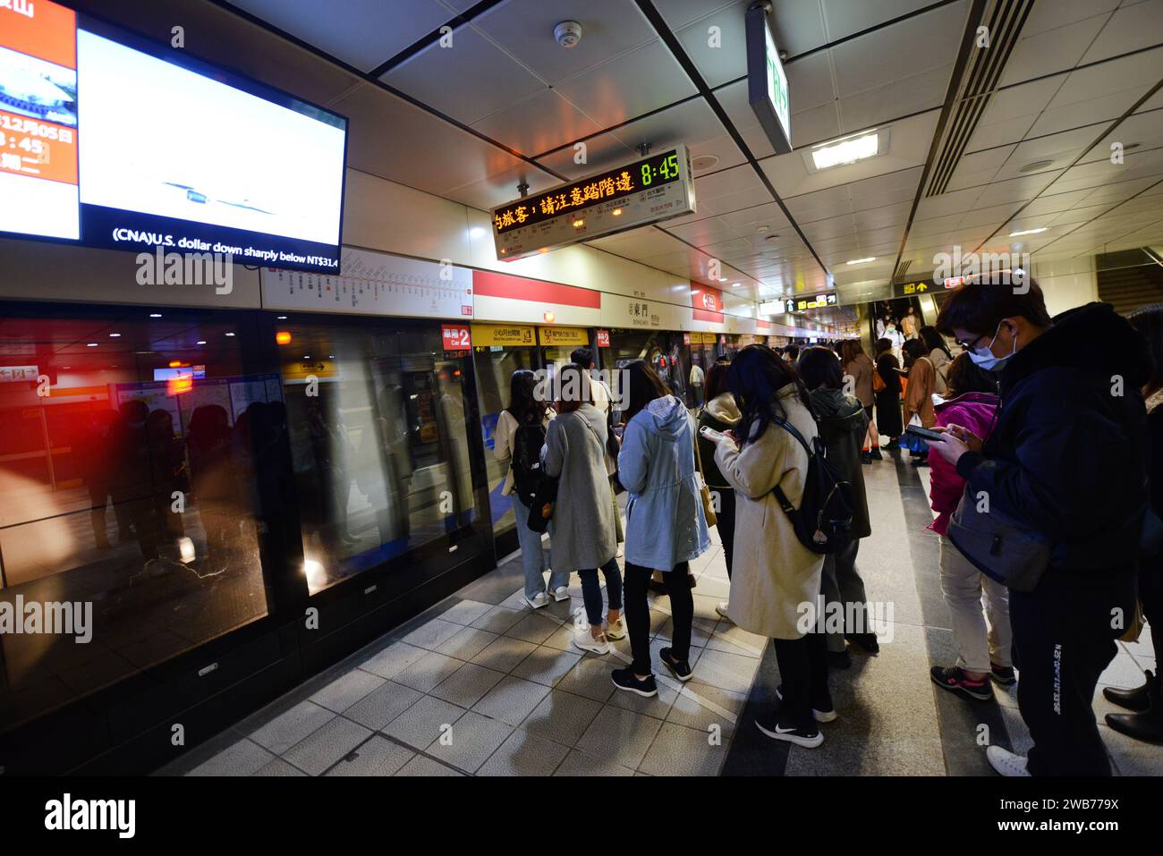 Passengers wafting for the metro train at Dongmen station in Taipei ...