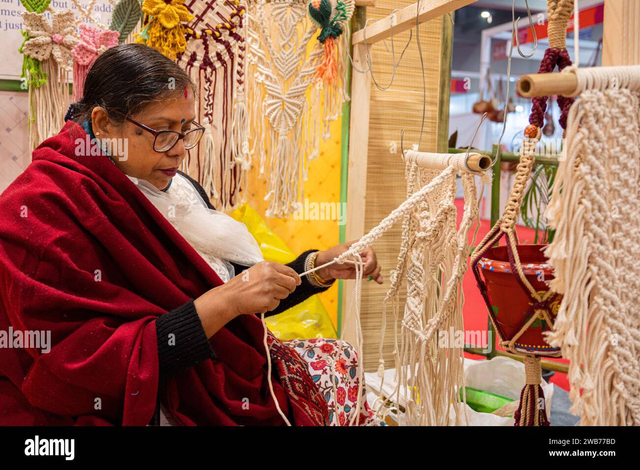 New Delhi, India. 08th Jan, 2024. An Indian artisan showcases the art ...