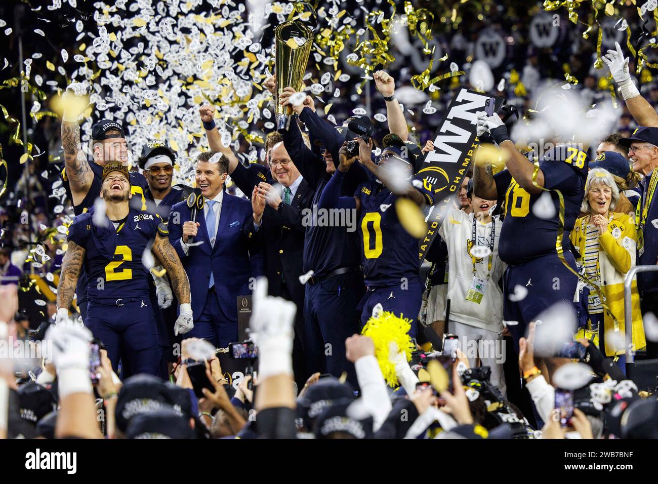 January 08, 2024: Michigan head coach Jim Harbaugh holds up the ...