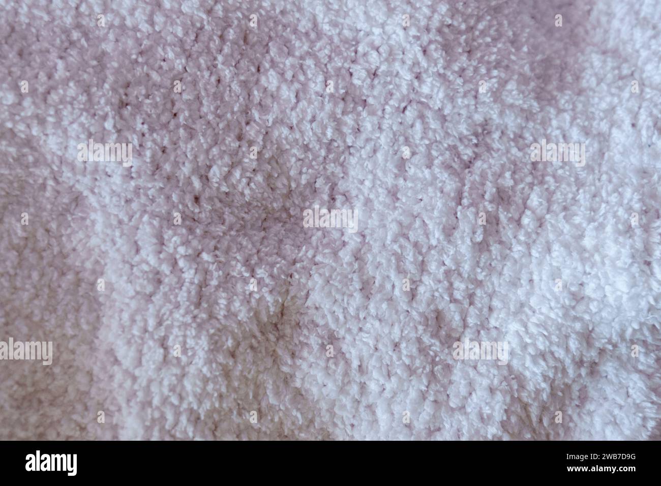 Delicate and cozy texture of a light-colored fabric, inviting a sense ...