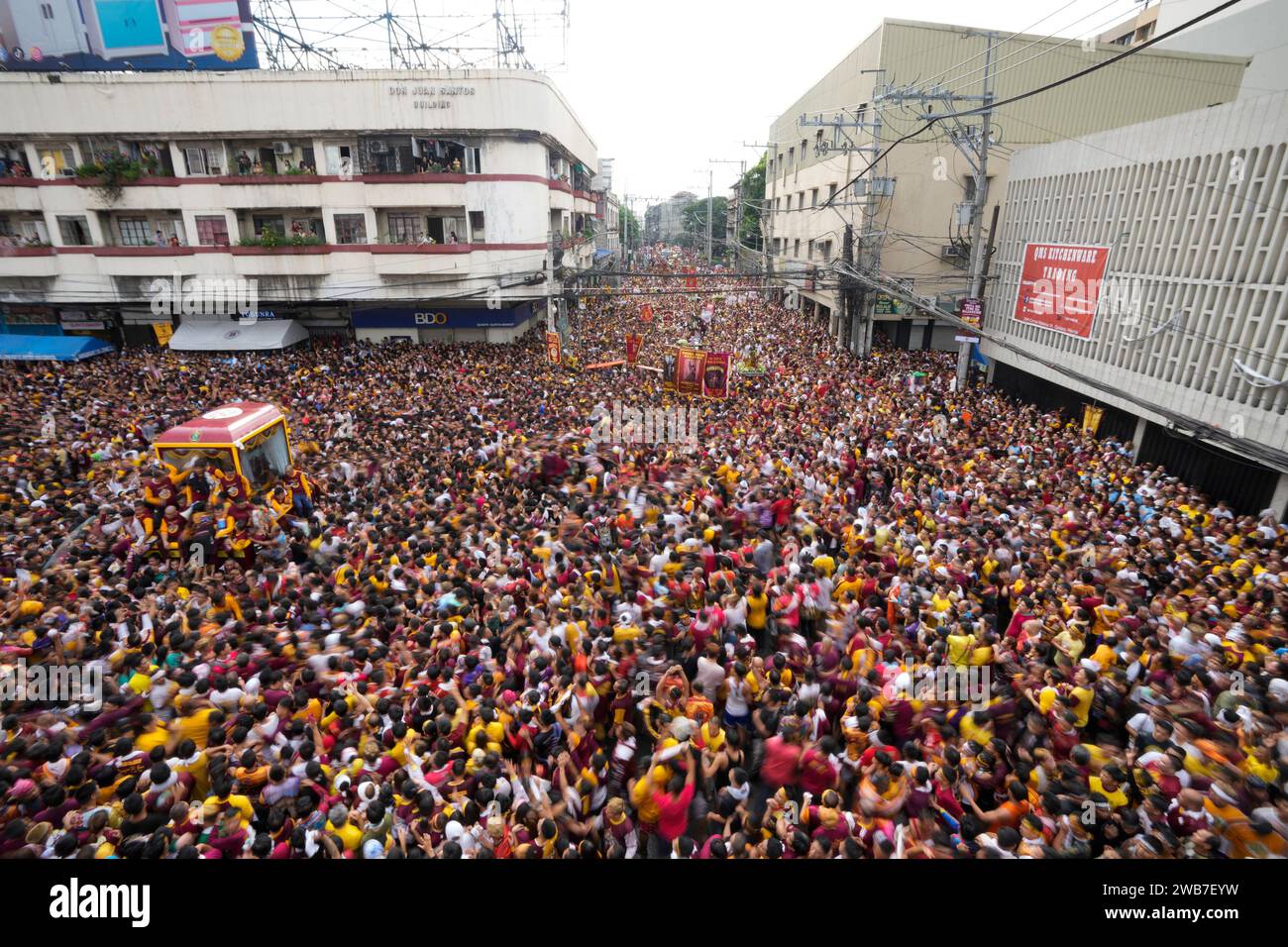 A glass-covered cart carrying the Black Nazarene makes its way through ...
