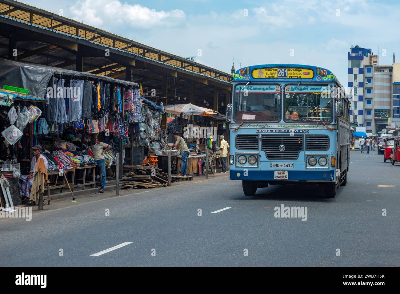 COLOMBO, SRI LANKA - FEBRUARY 23, 2020: A city bus passes by a street ...