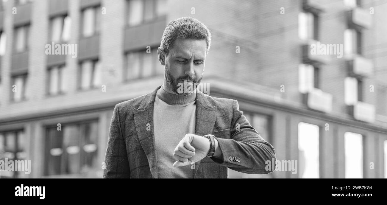 punctual man checking time outside. photo of punctual man check time on ...