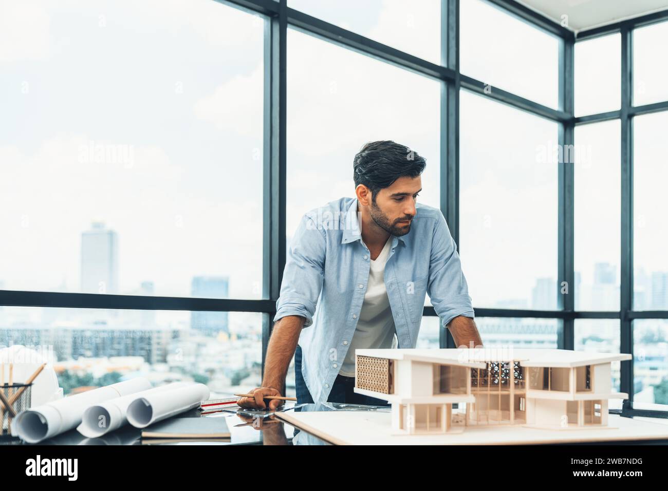 Smart civil architect engineer looking while planing design house ...