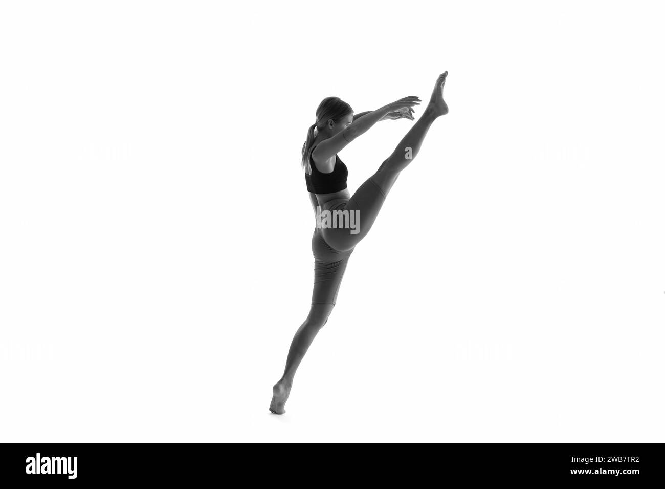 athlete sport woman do split on background. photo of sport woman do ...