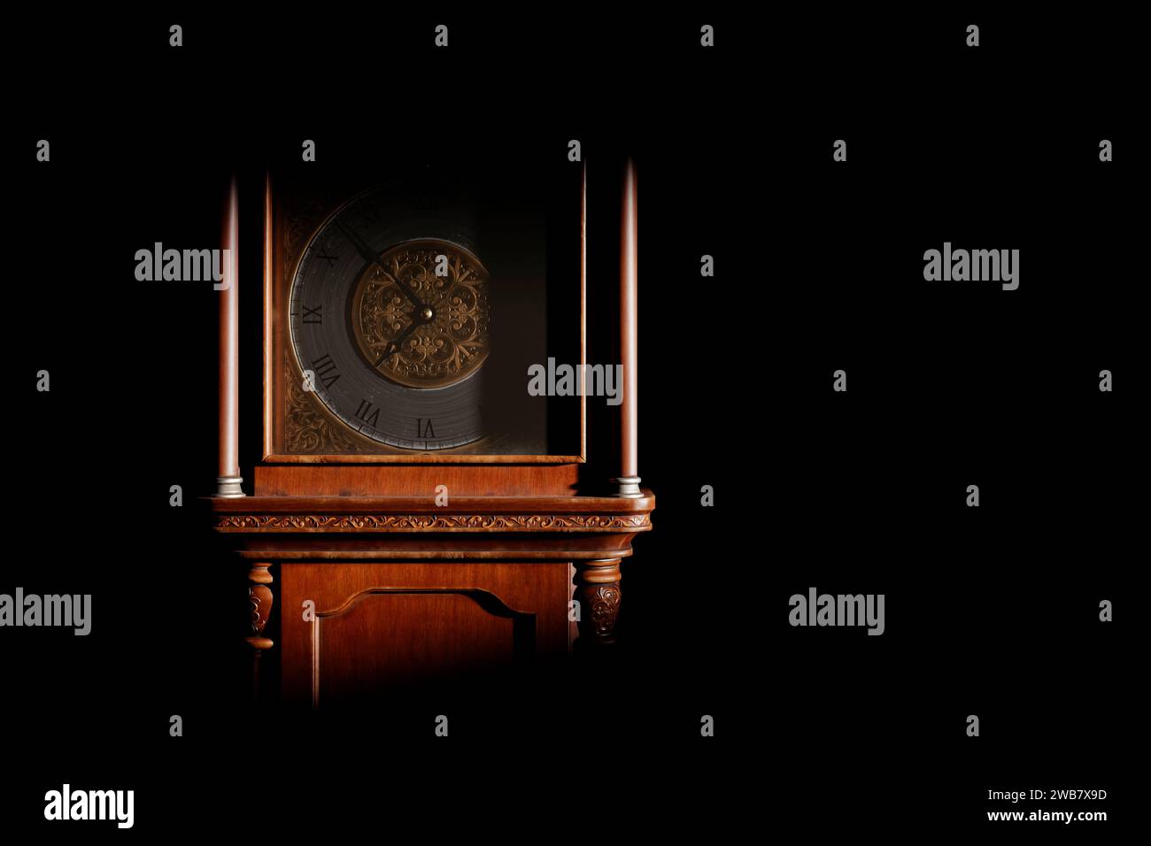Close-up of the dial of an antique grandfather clock in a dark room ...