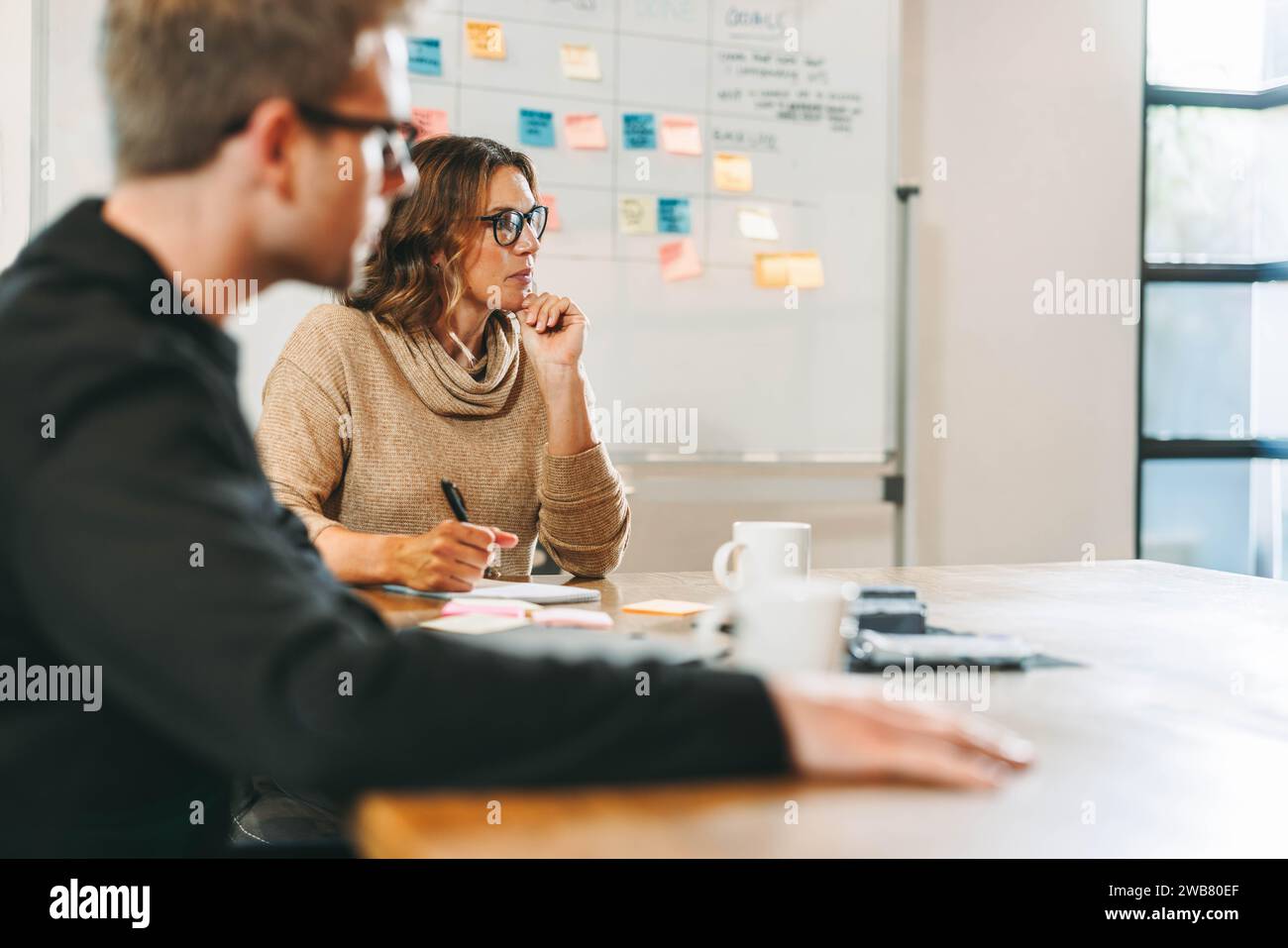 Business People In A Bright Office Engage In Collaborative Brainstorming The Team Discusses
