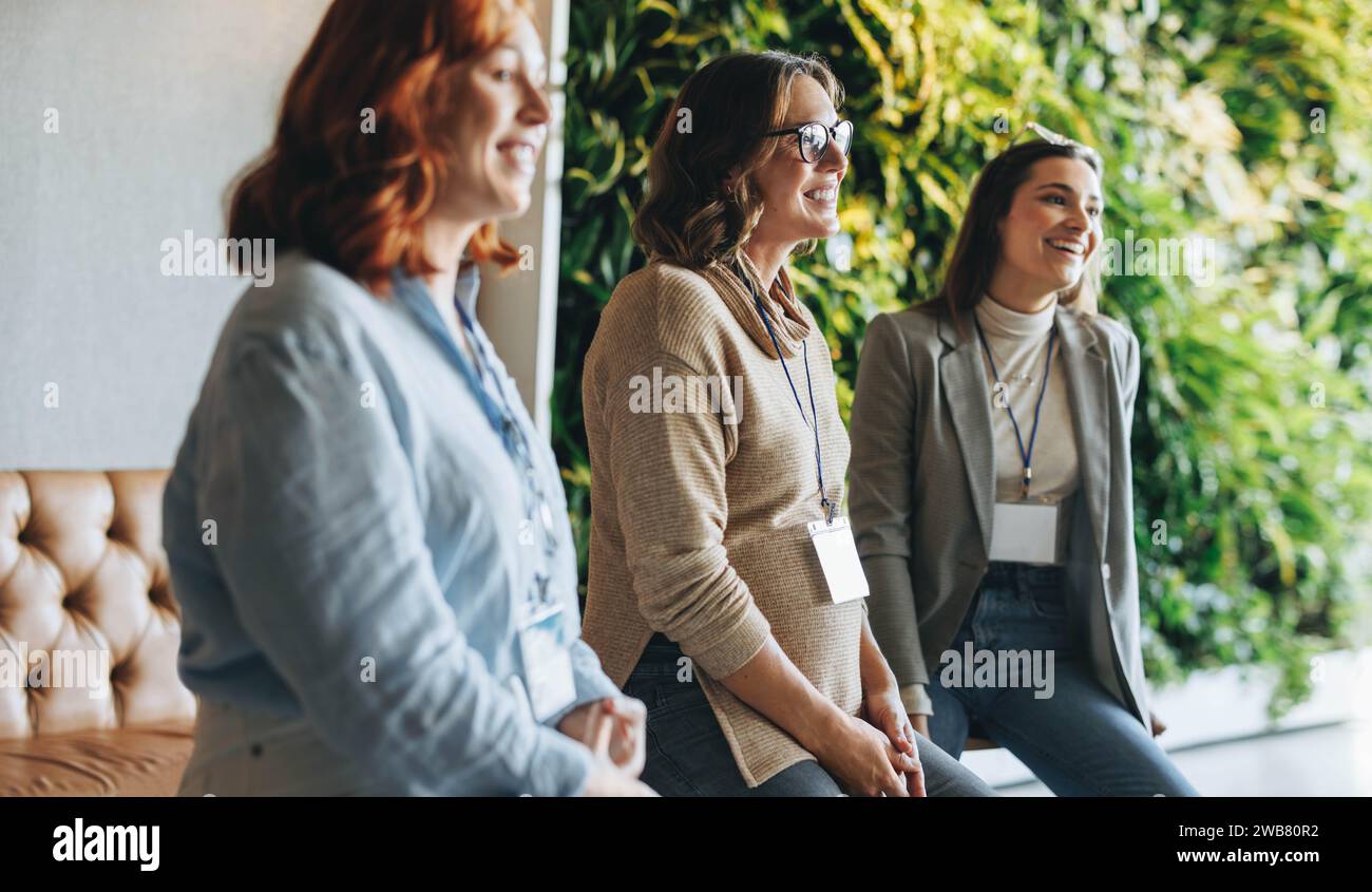 Diverse business professionals engage in a lively meeting in an office ...