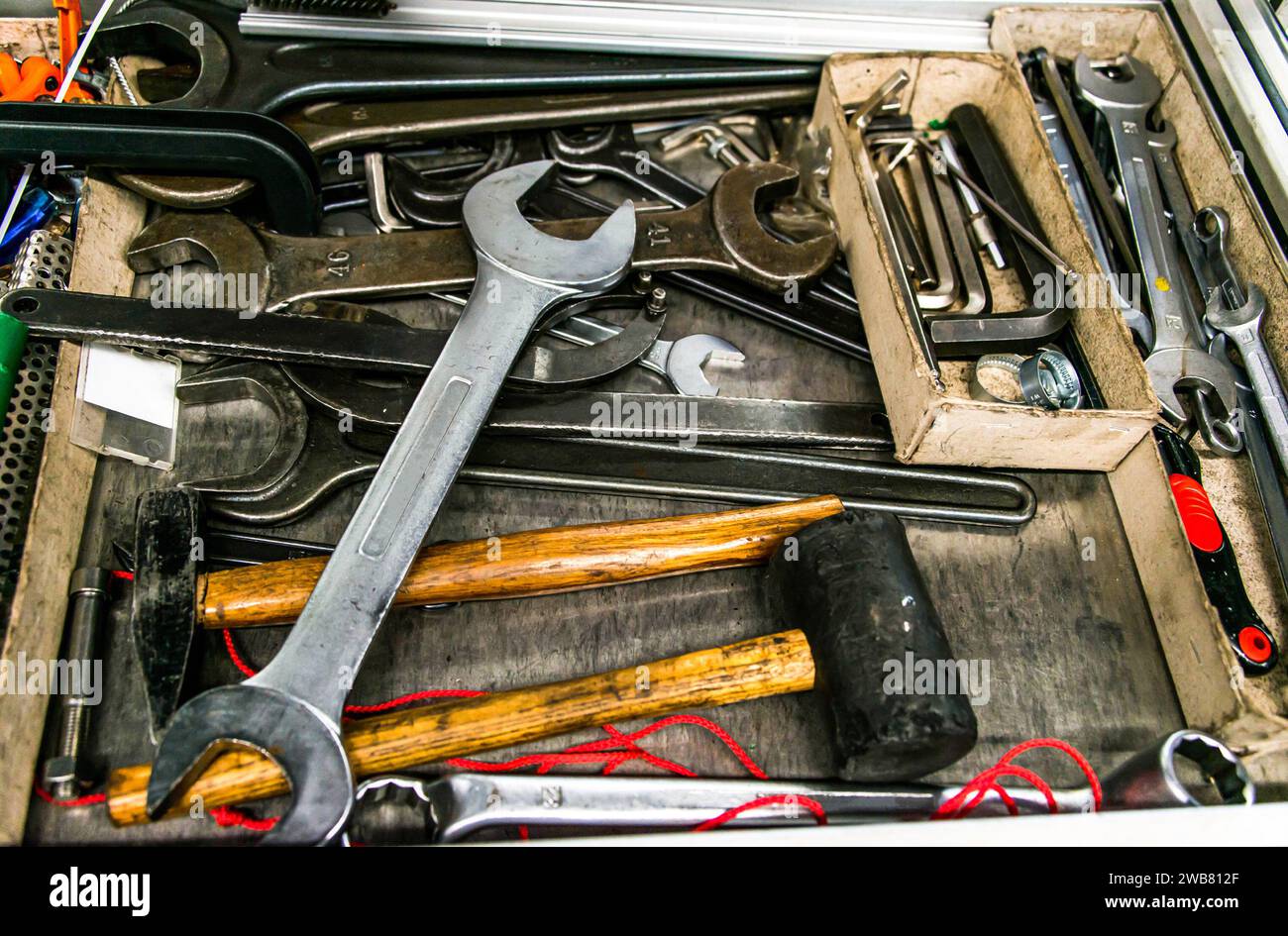 Wooden tool box of hand tools with old and dirty, rusty wrenches, ring ...