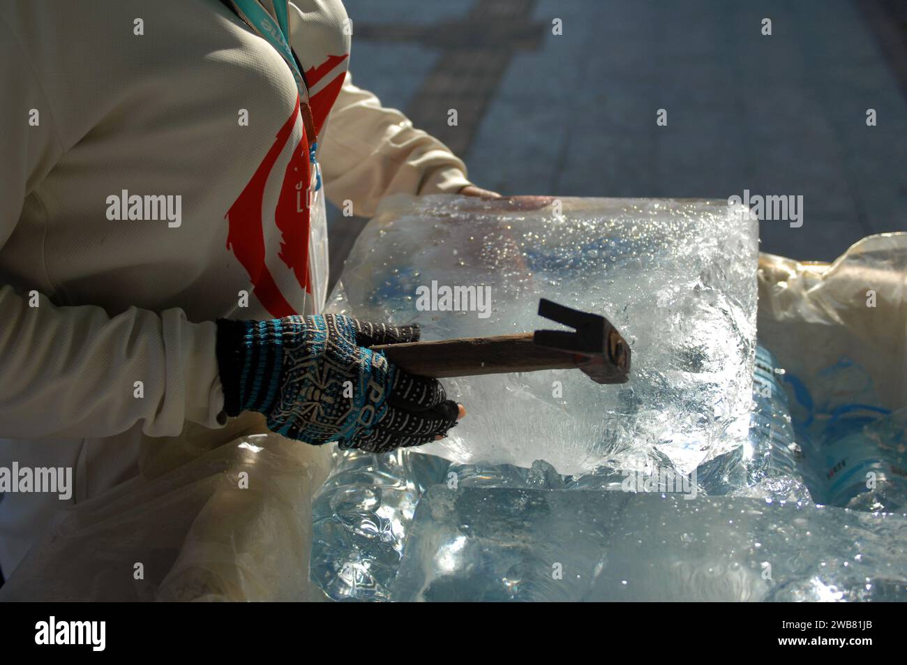 Woman breaking block of ice with an axe, Siem Reap, Cambodia Stock ...
