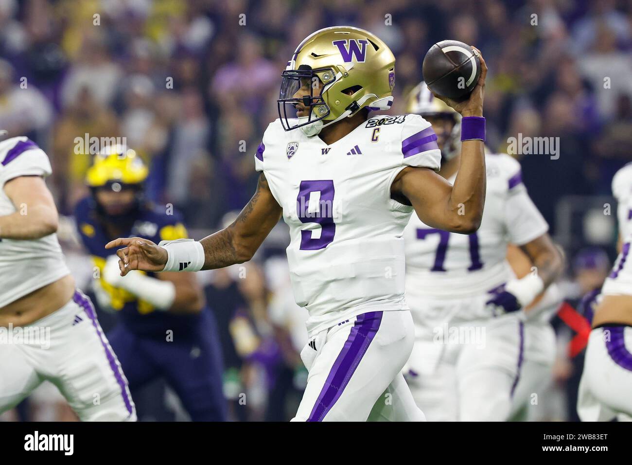 January 8, 2024: Washington Huskies quarterback Michael Penix Jr. (9) throws on the run during ...