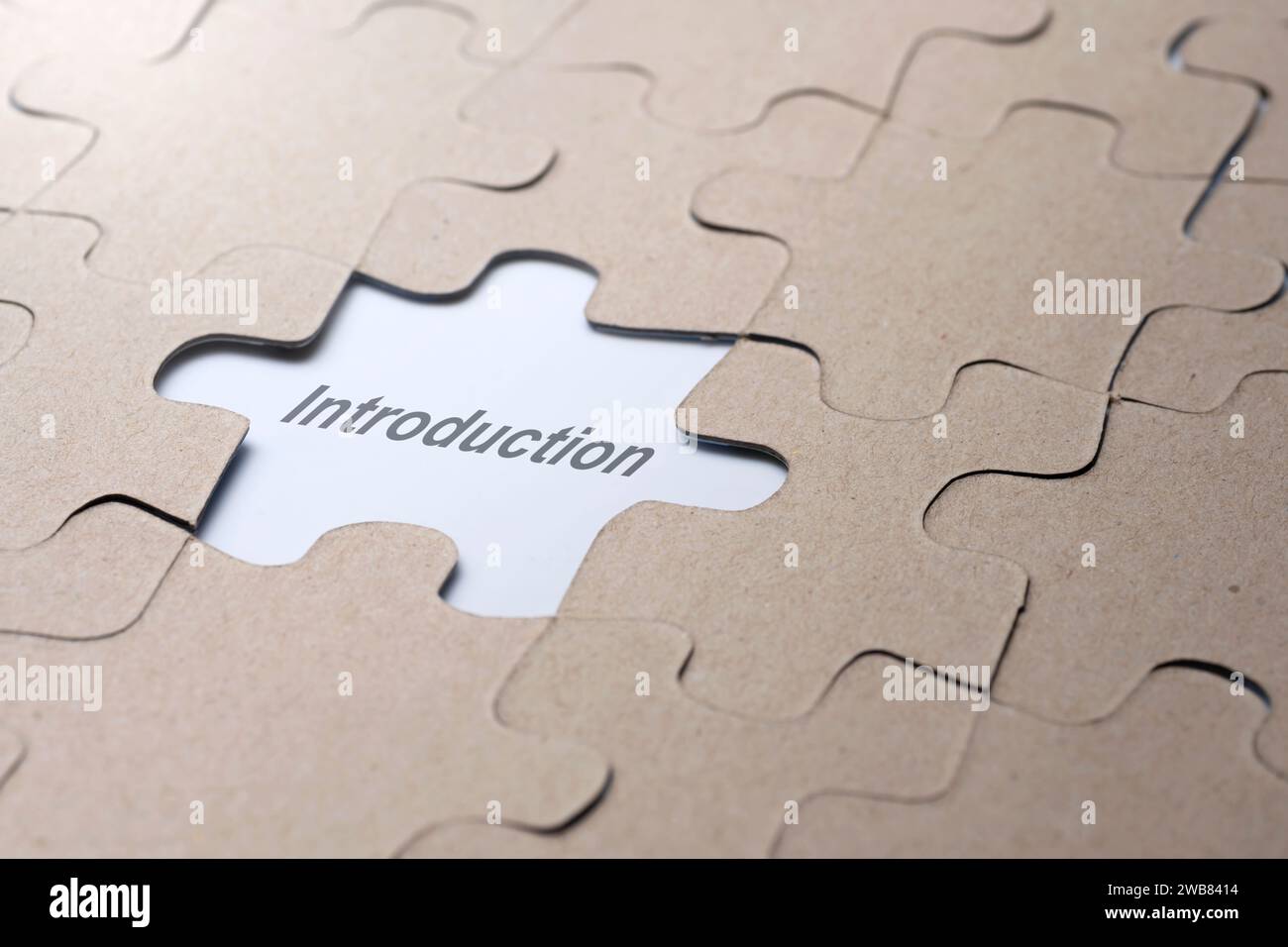 Piece of missing jigsaw puzzle with Introduction text over white ...