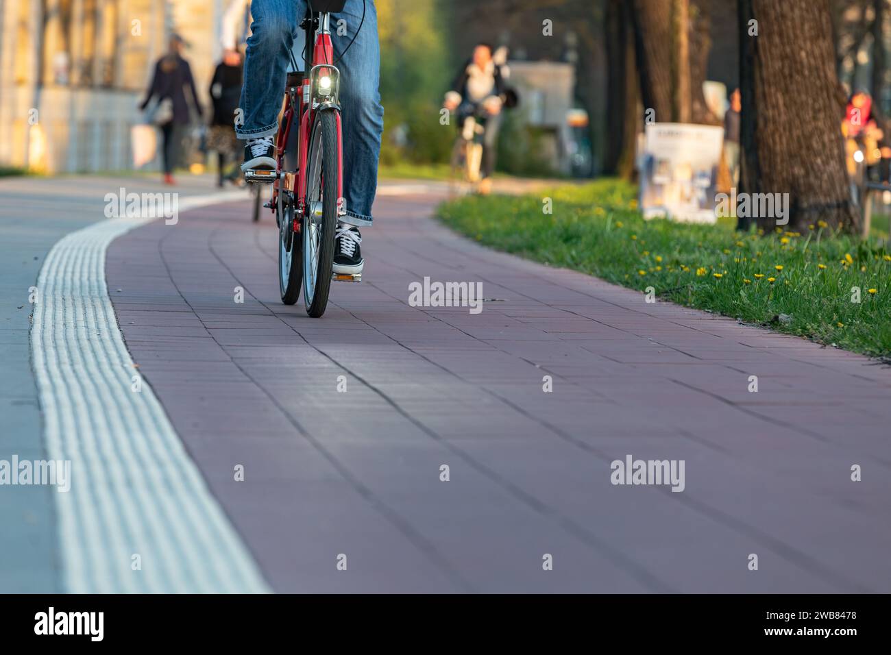 red bike on red bike path Stock Photo - Alamy