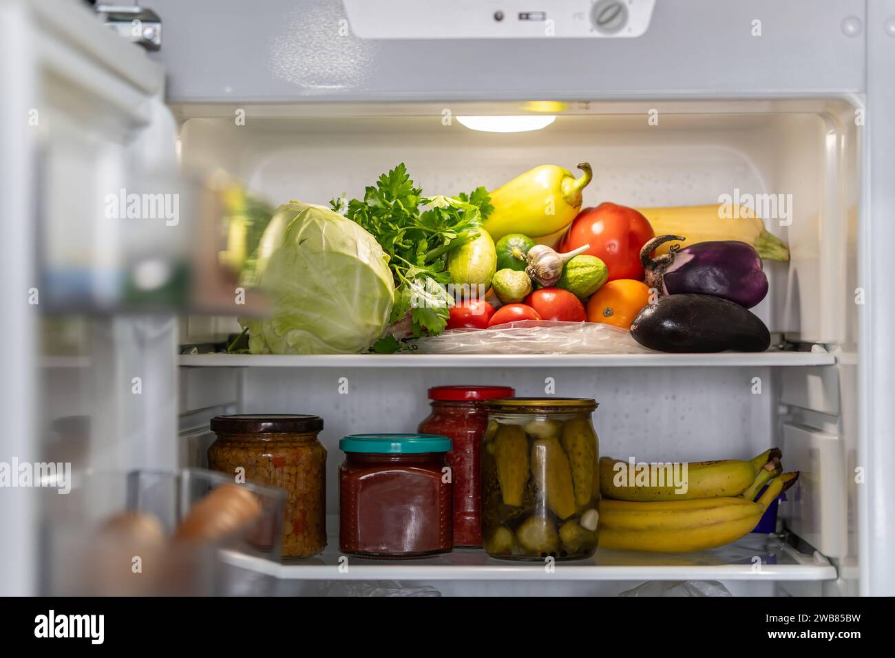 Many different fresh products in modern refrigerator. fresh vegetables ...