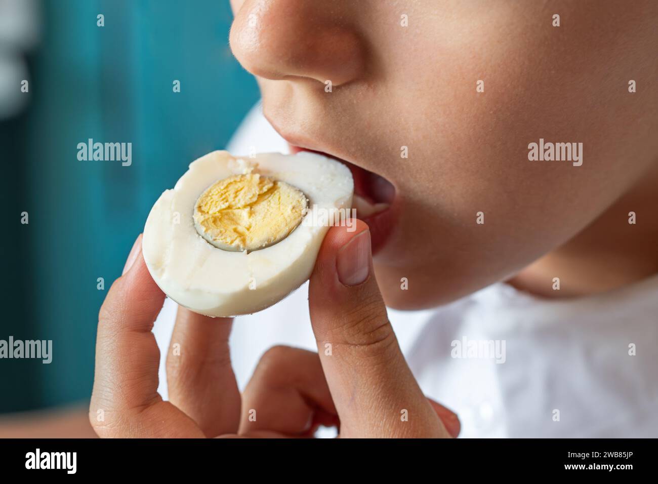 girl eating tasty egg, close up mouth. Health care, loss weight people ...