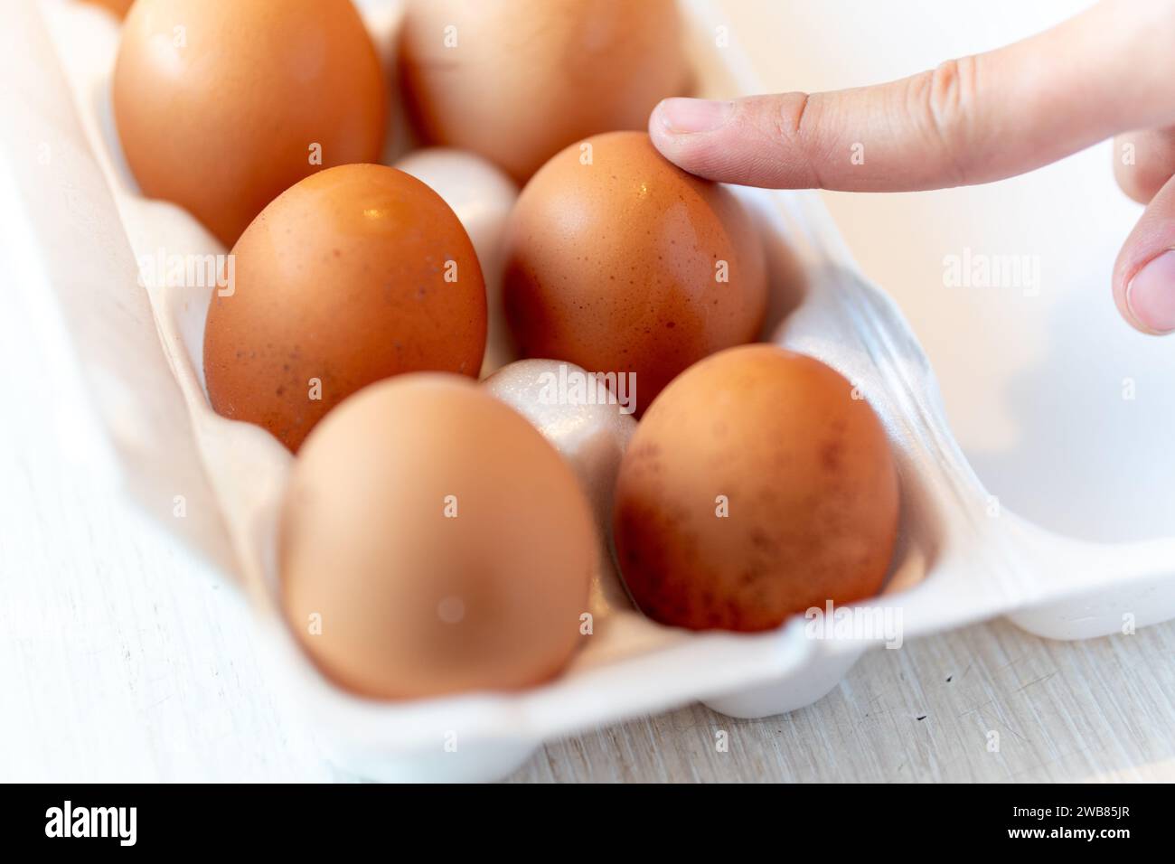 Woman buying eggs hi-res stock photography and images - Alamy