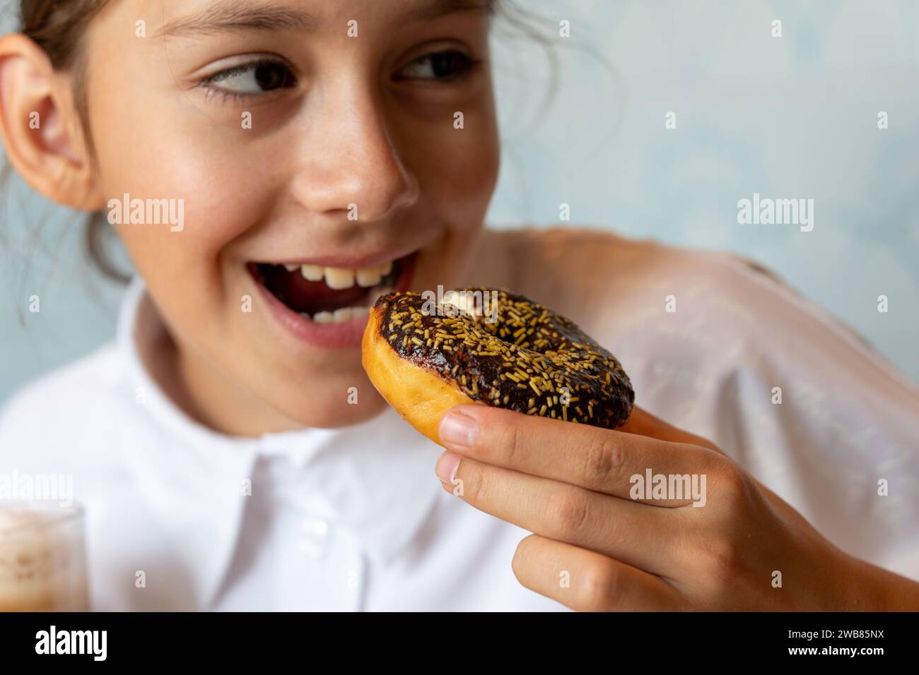 Girl Eating Sugary Donut Girl Eating Cake In Winter Portrait Of