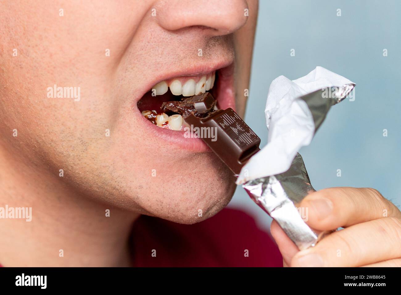 Fat boy eating chocolate hi-res stock photography and images - Alamy