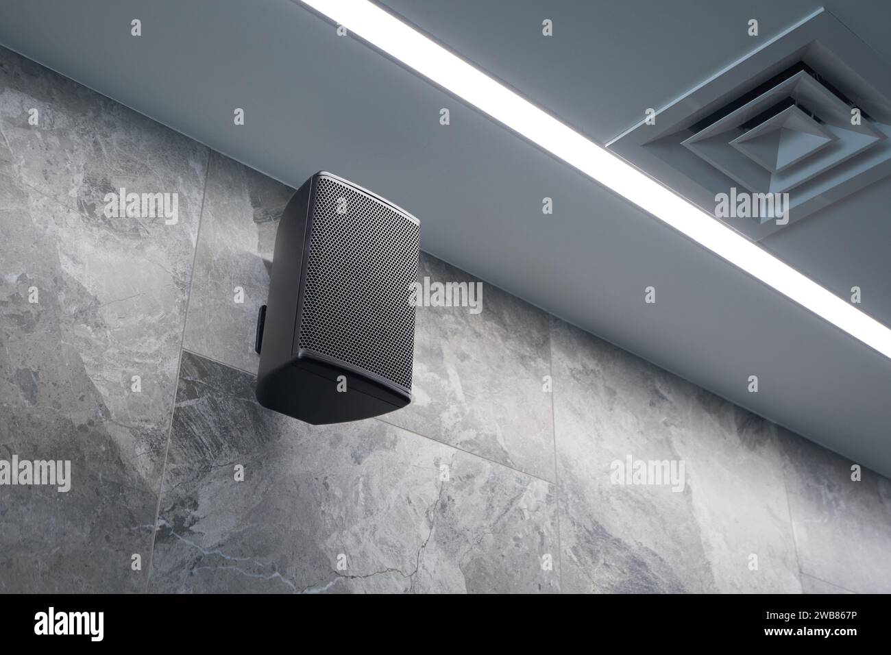 Black wall speaker installed in building sound system Stock Photo - Alamy