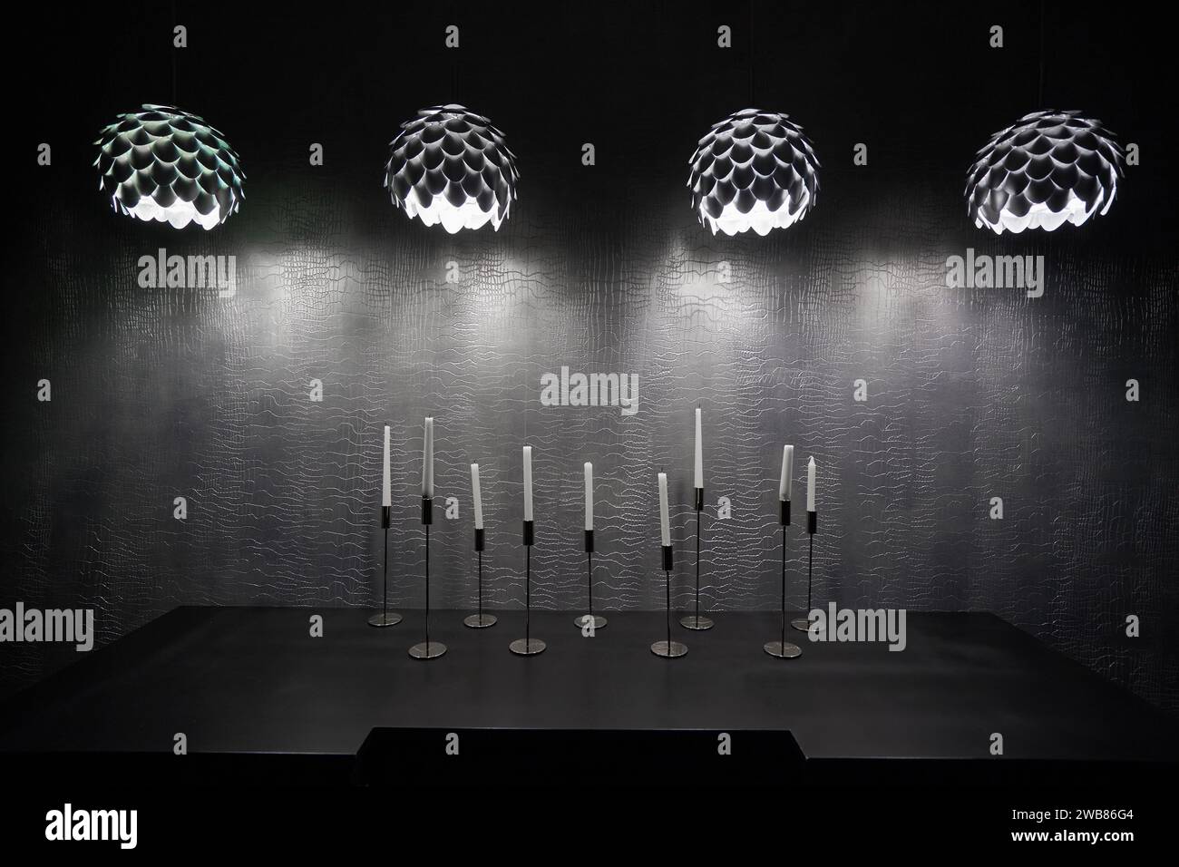 Stylish chandelier lighting of a dark wall with space for text Stock ...