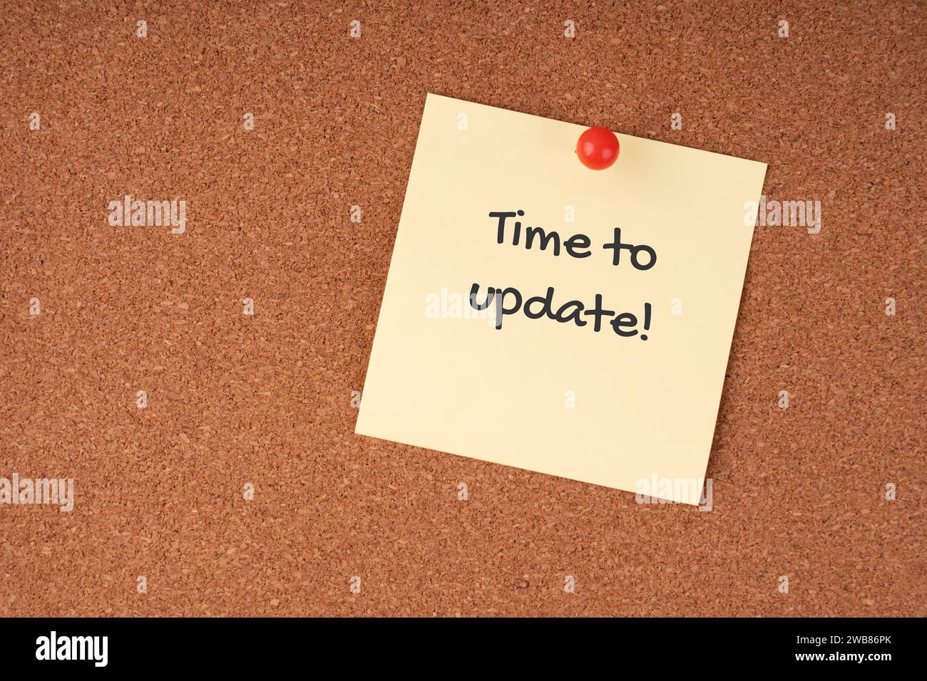 Time to update text on adhesive note Stock Photo - Alamy