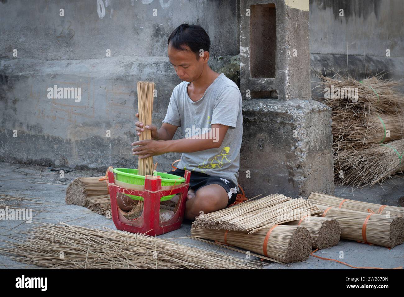Man making incense sticks at Quang Phu Cau Incense Village in Hanoi ...