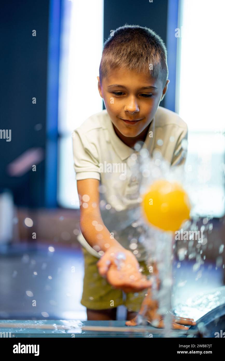 Little boy playing in a science museum Stock Photo - Alamy