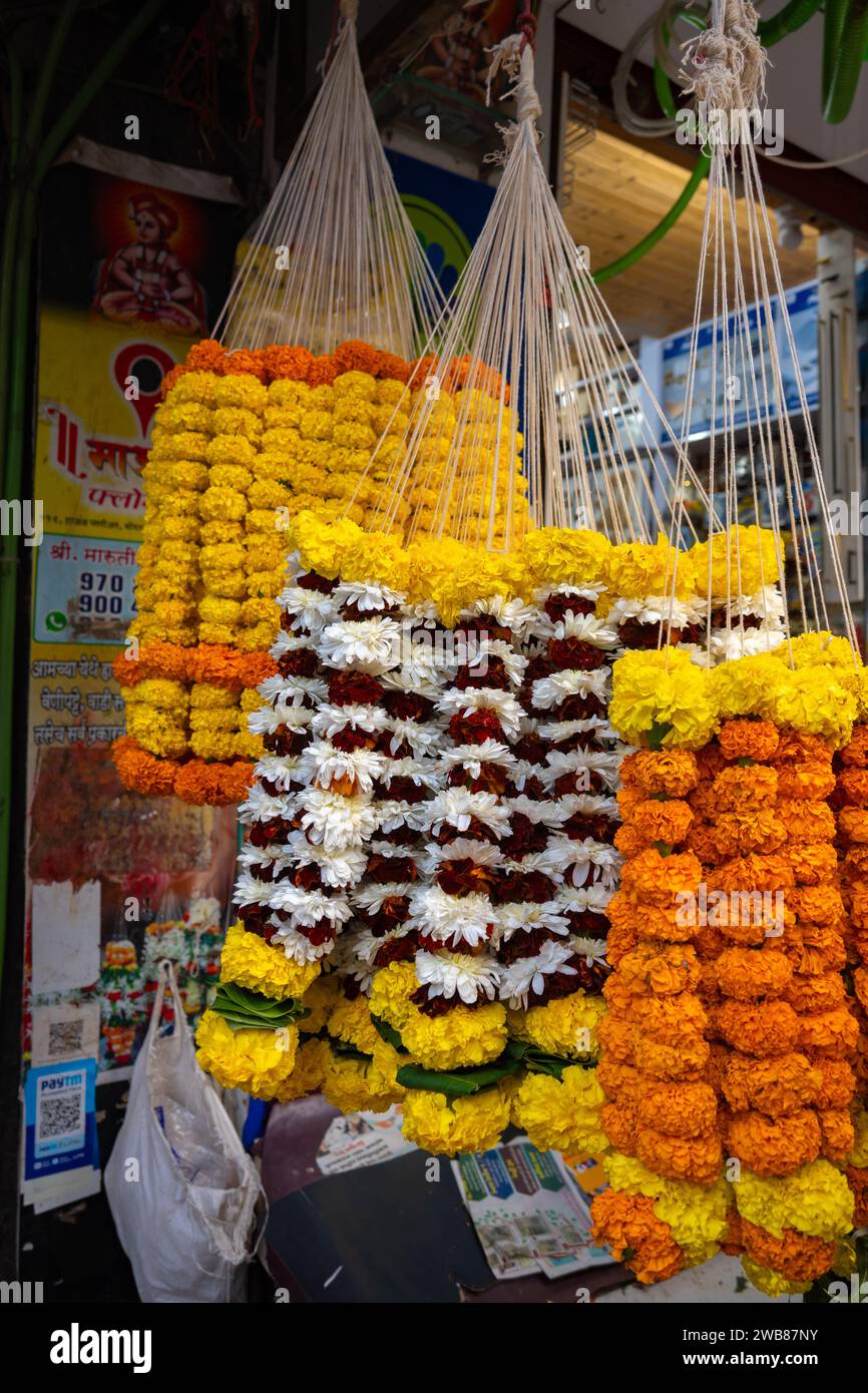 Mumbai, Maharashtra, India, Hindu offerings made of flowers at a stand ...