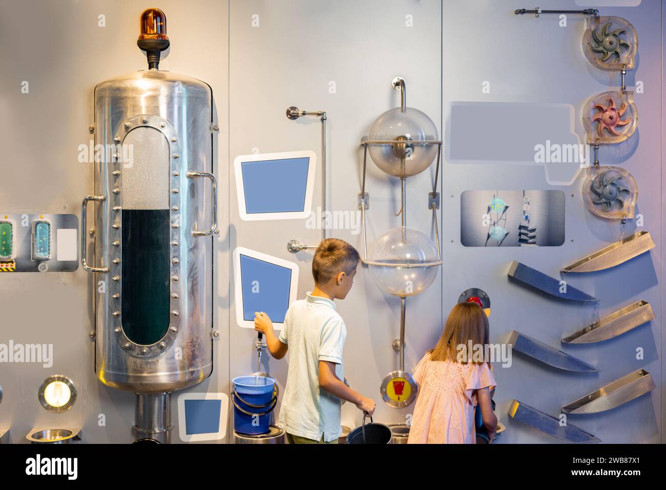 Little boy and girl visit a science museum Stock Photo - Alamy