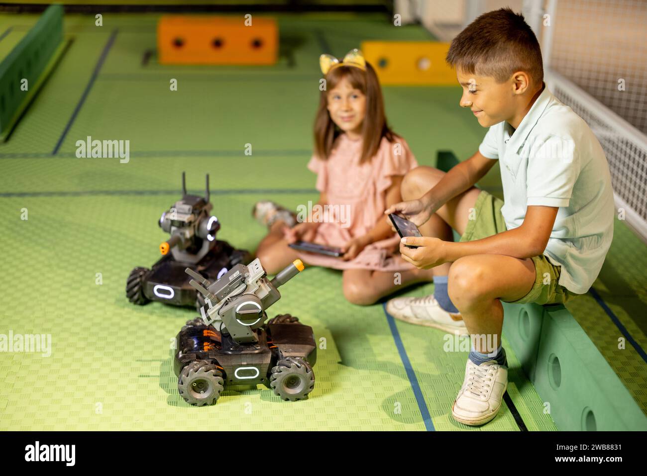 Kids playing with robotic cars Stock Photo - Alamy
