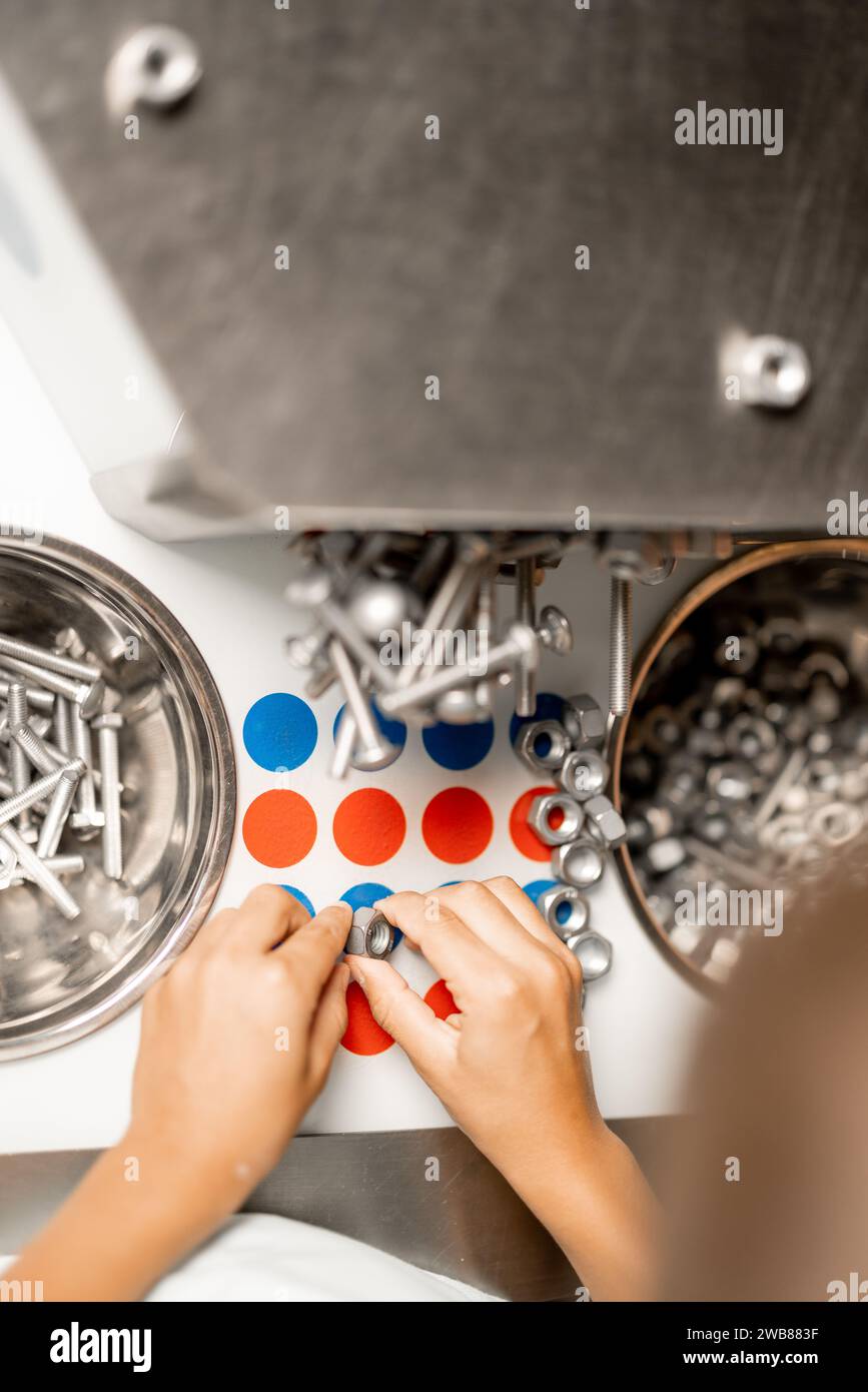 Kids play with magnets in science museum Stock Photo - Alamy