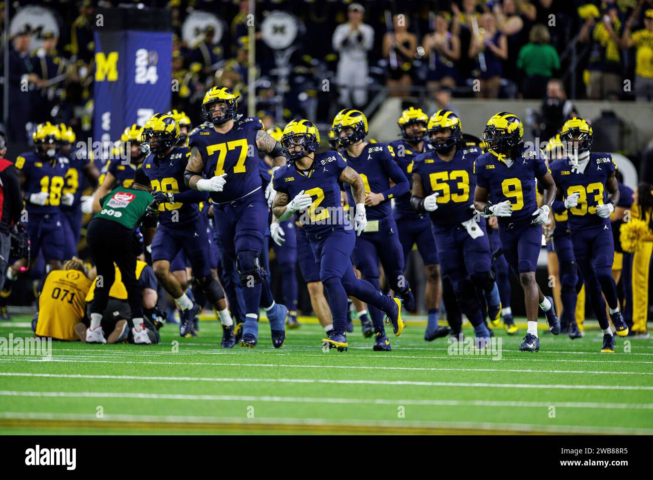 January 08, 2024: Michigan Wolverines players take the field during ...