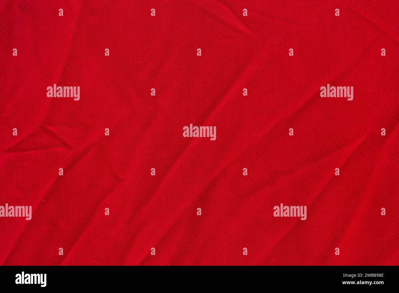 A bold shade of red and is heavily creased, creating a textured look ...