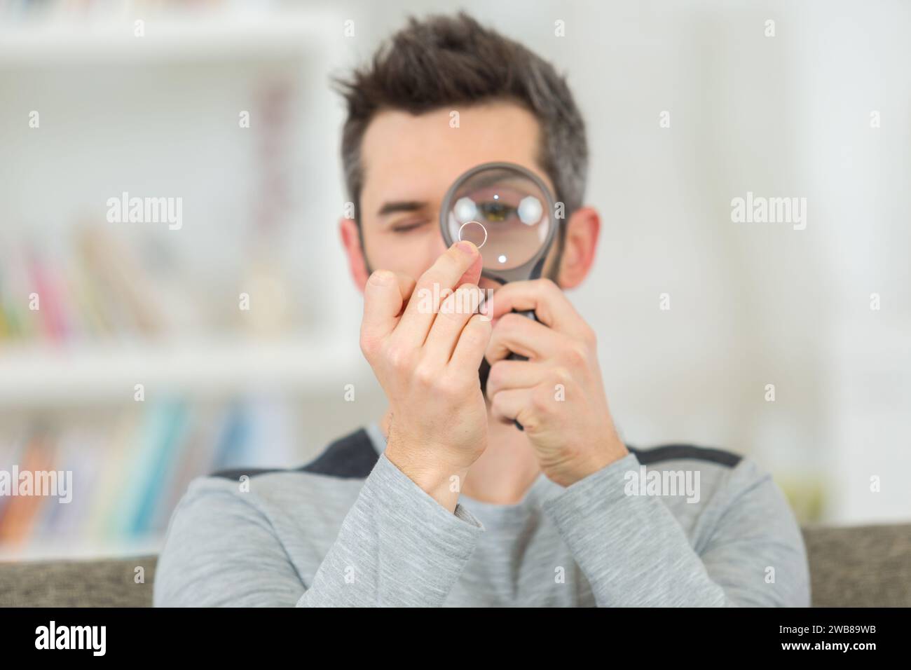 Male inspector looking through magnifying hi-res stock photography and ...