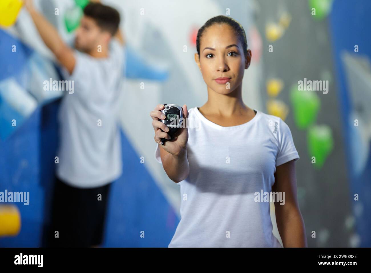 woman showing stopwatch to camera Stock Photo - Alamy