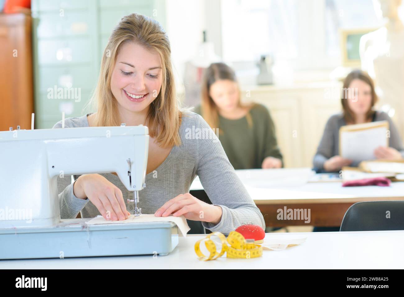 woman is on a tailoring class Stock Photo - Alamy