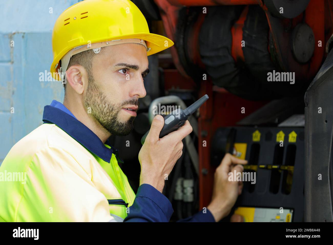construction worker with bulldozer during earth moving works Stock ...