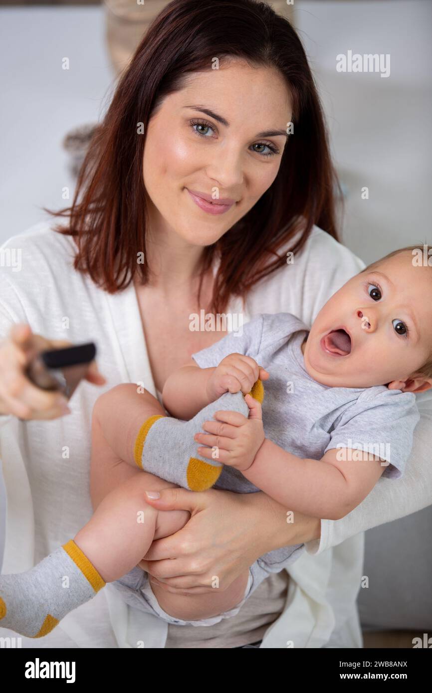 Baby with remote control hi-res stock photography and images - Alamy