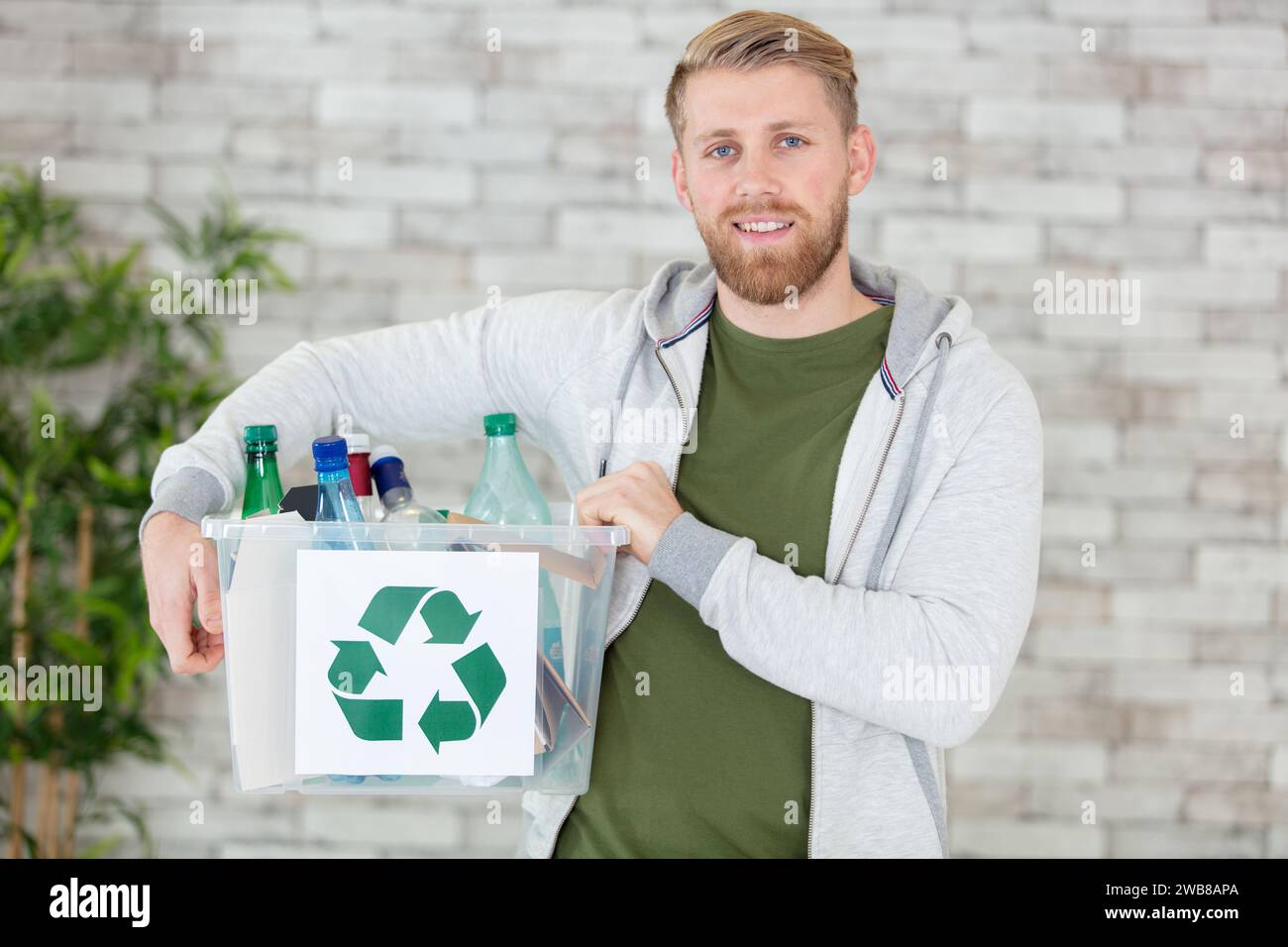 a young man recycling plastic bottles Stock Photo - Alamy