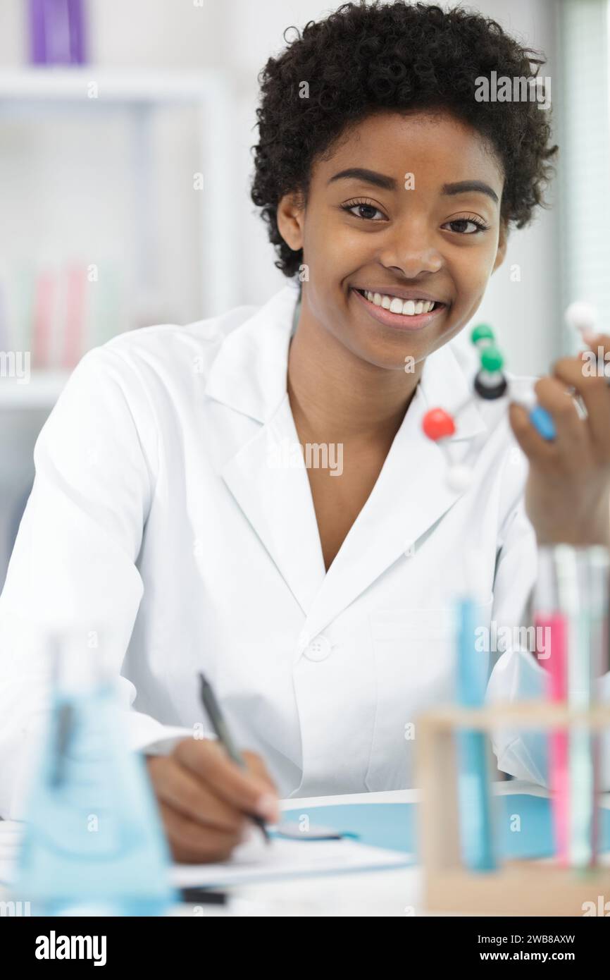 scientist in lab coat and protective wear works in laboratory Stock ...