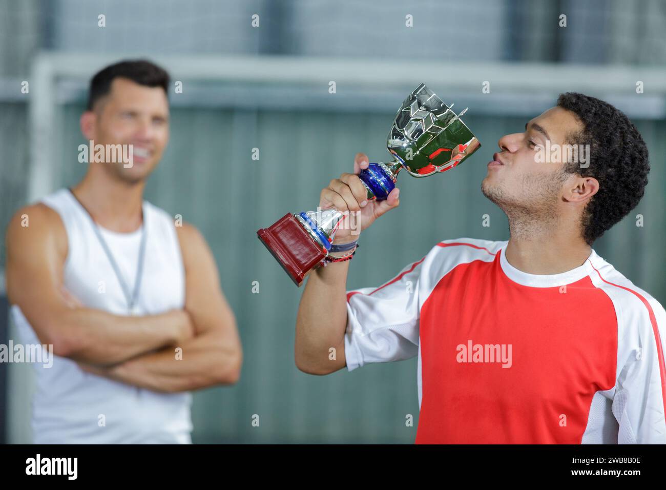 Man kissing trophy hi-res stock photography and images - Alamy