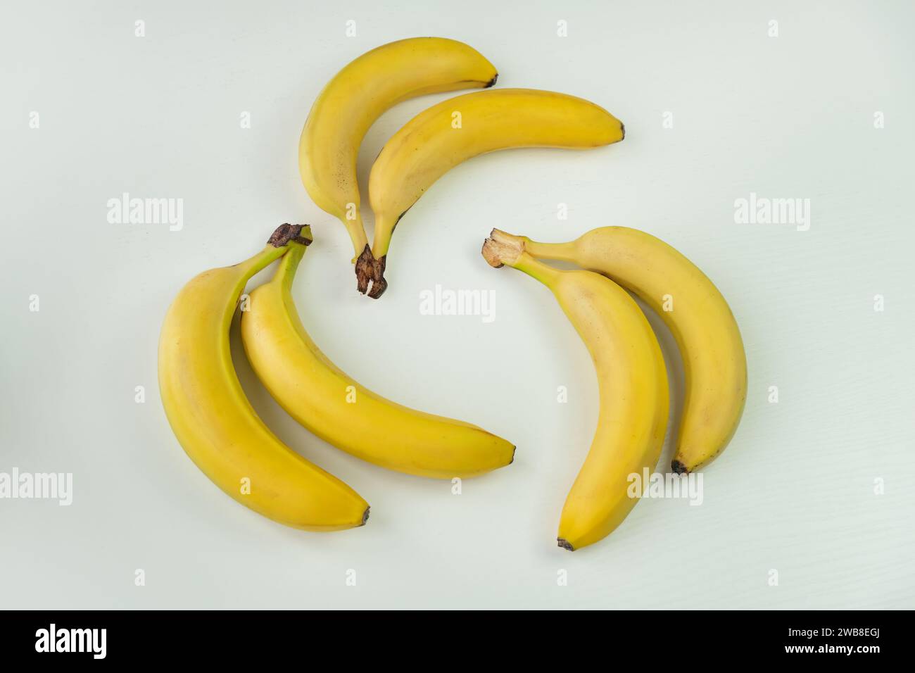 Three by two bananas on a white background Stock Photo - Alamy