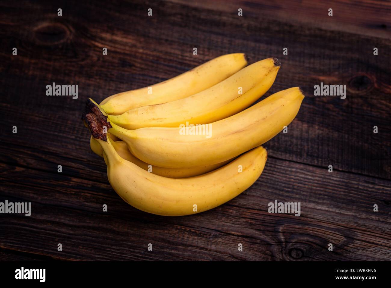 Bunch cavendish bananas on table hi-res stock photography and images ...