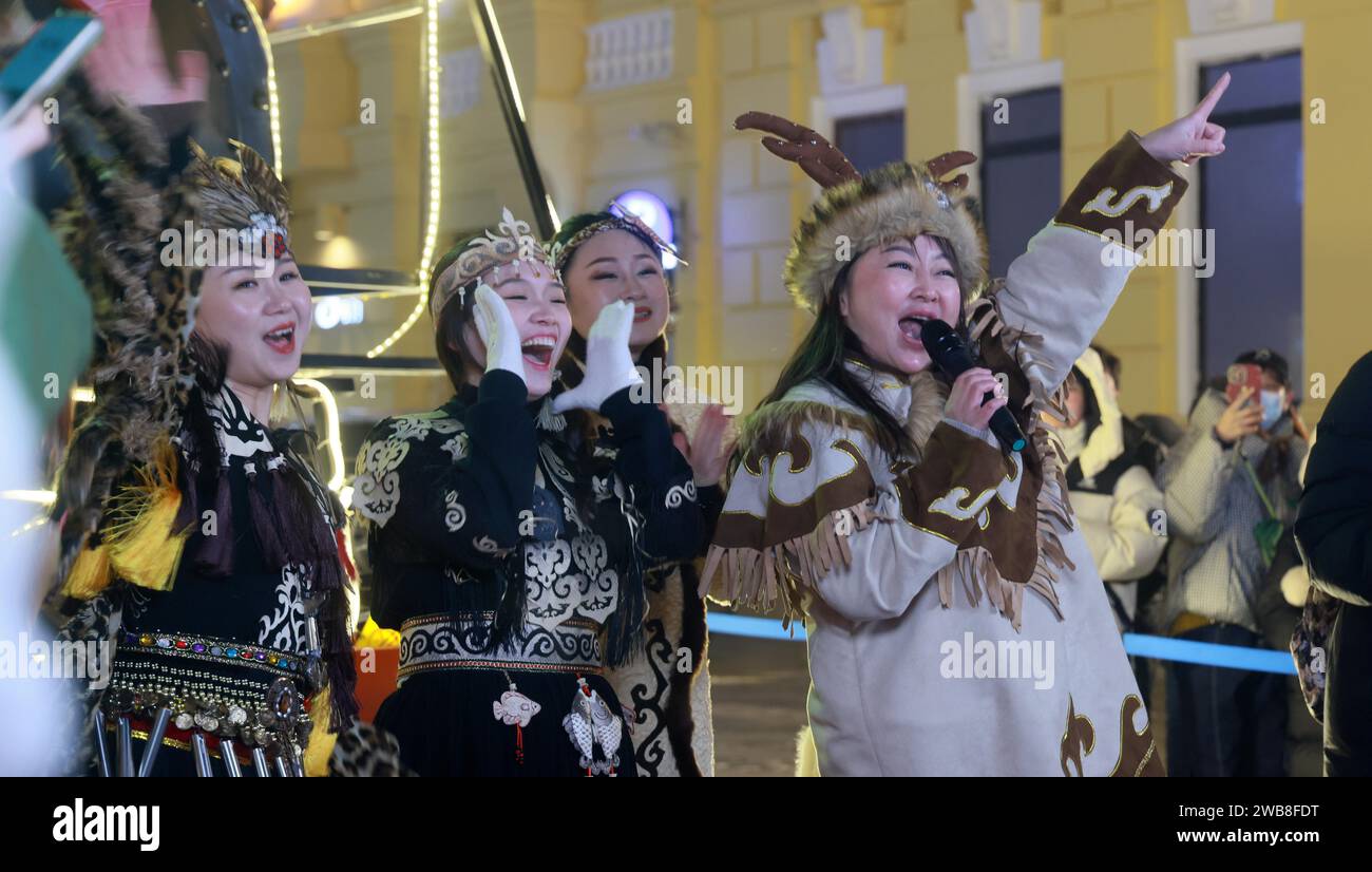 People from Hezhen ethnic group perform and send special local product ...