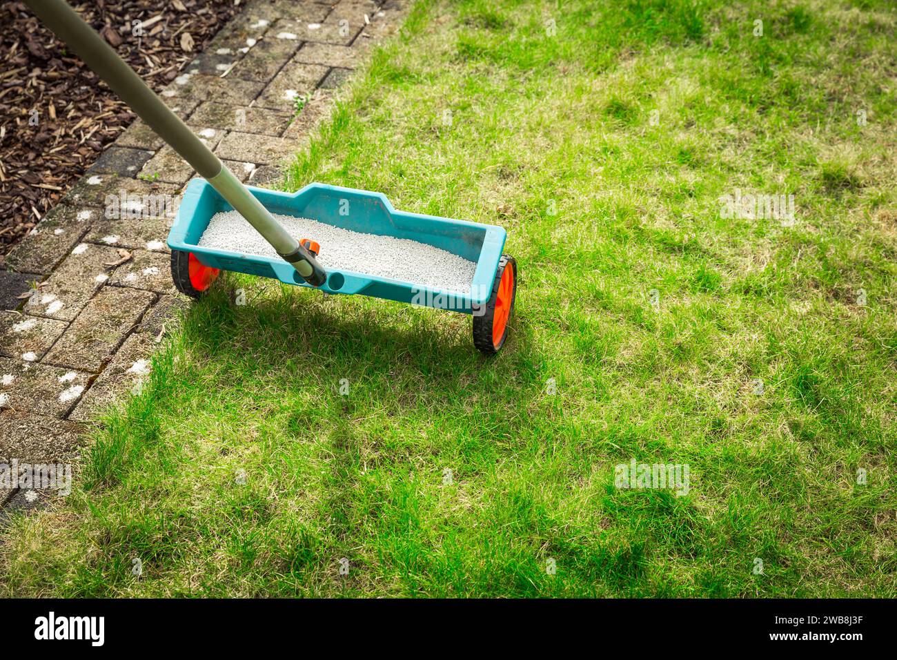 Lawn care - Lawn Spring Fertilization tool Stock Photo - Alamy