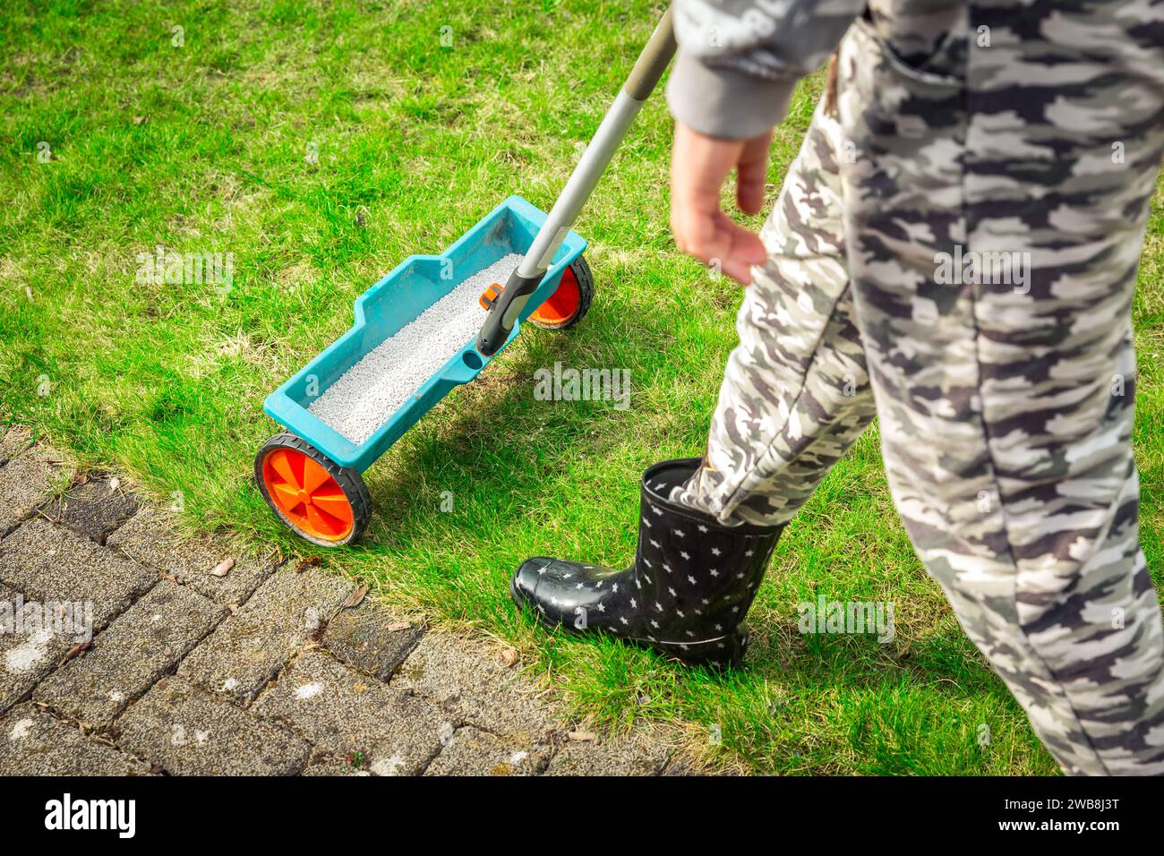 Lawn care - Lawn Spring Fertilization tool Stock Photo - Alamy