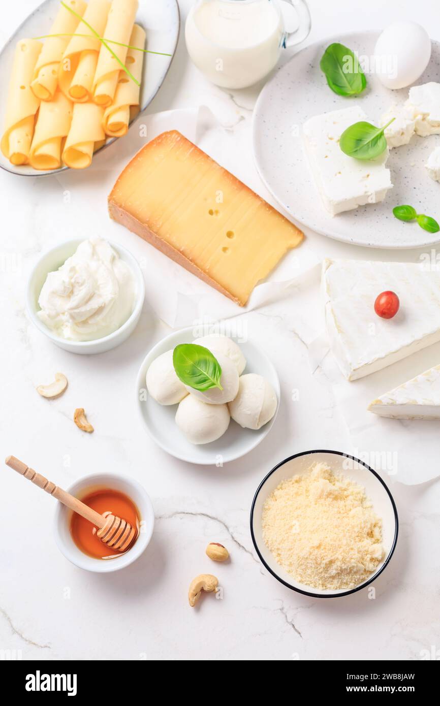 Assortment of different dairy products on white table Stock Photo - Alamy