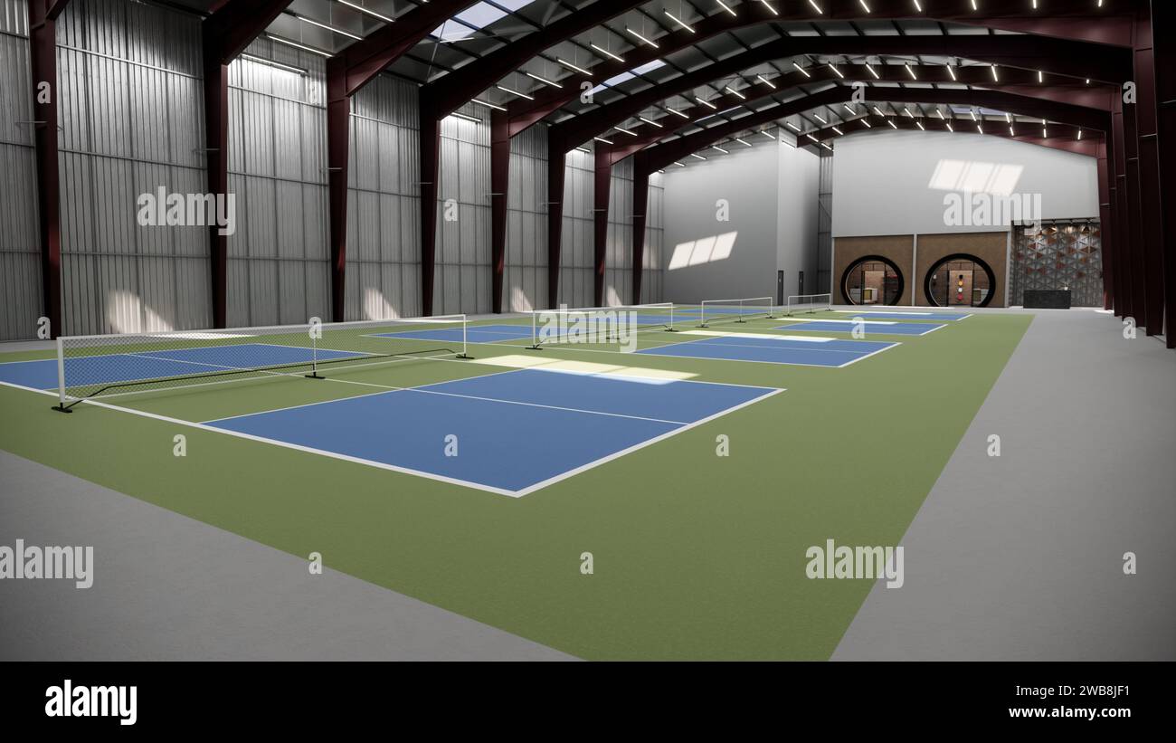 indoor pickleball court inside the warehouse building with green and ...
